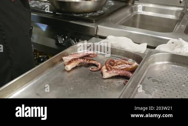 Octopus Tentacles on Frying Pan. Preparation Seafood by Chef Cook at ...