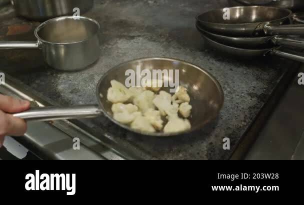 Cauliflower on Frying Pan. Food Preparation by Chef Cook at Restaurant ...