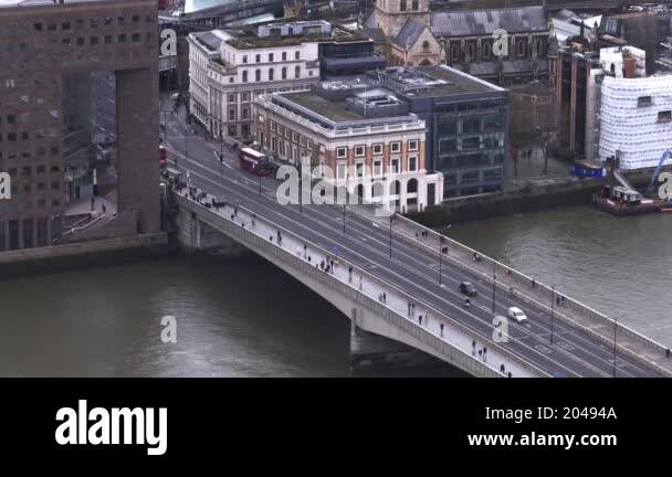 Sweeping aerial view of London Bridge over the River Thames, featuring ...