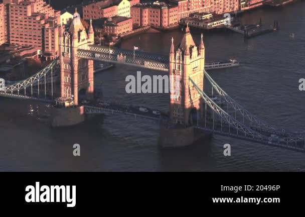 Tower Bridge's towers and suspension elements are highlighted at sunset ...