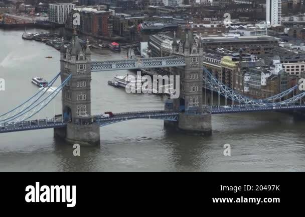 Tower Bridge's iconic towers and suspension span the River Thames, with ...