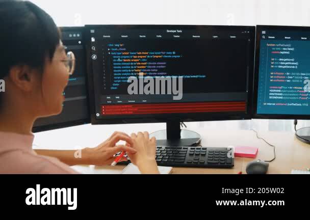 Slow motion back end software developer engineer for computer programming working together on ...