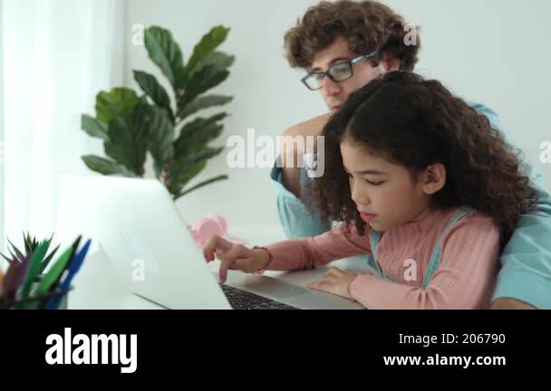 Caucasian father teaching attractive daughter about coding engineering ...