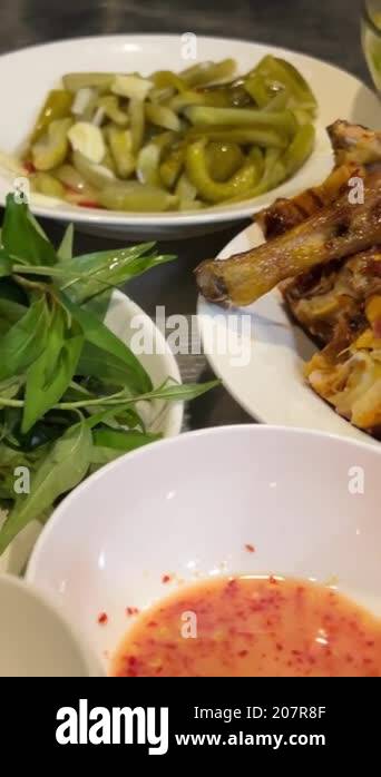 Eating poke bowl close-up, taking meat with chopsticks. Traditional ...