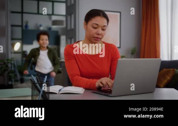 Busy concentrated African American business woman mother businesswoman ...