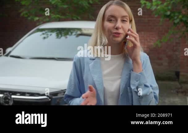 Smiling Caucasian lady transport buyer woman client speaking mobile ...