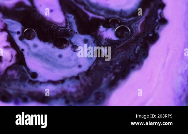 Bubble fluid wave. Paint blend. Defocused neon purple blue pink black ...