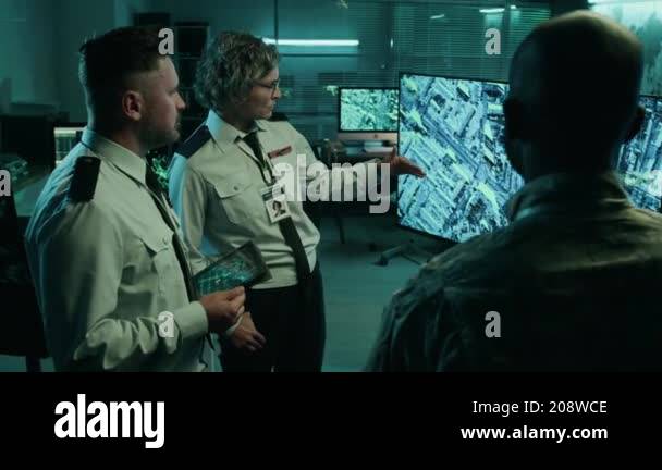 Medium of Caucasian female army officer in uniform standing by ...