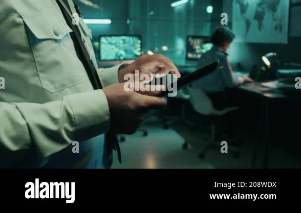Side closeup of hands and face of Caucasian army commander in uniform ...