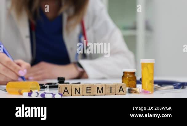 A healthcare professional is writing detailed anemia notes with ...