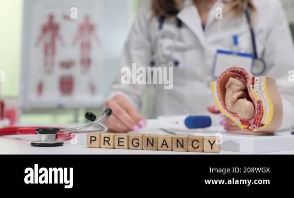 During a pregnancy consultation, a healthcare professional conducts an ...