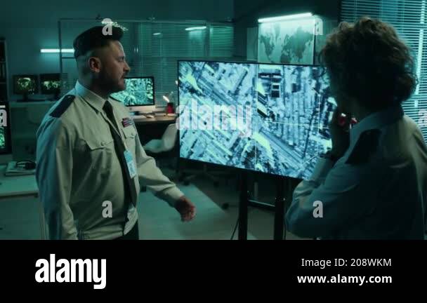 Medium shot of diverse Caucasian male and female military strategists ...