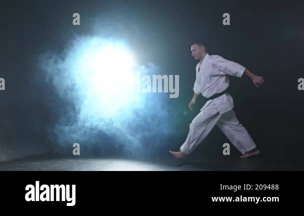 Strong man fighter in white kimono for karate martial arts with black ...