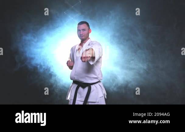 Strong man fighter in white kimono for karate martial arts with black ...