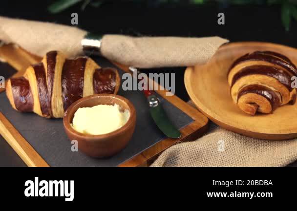 Breakfast features gluten-free croissants with creamy spread on wooden ...