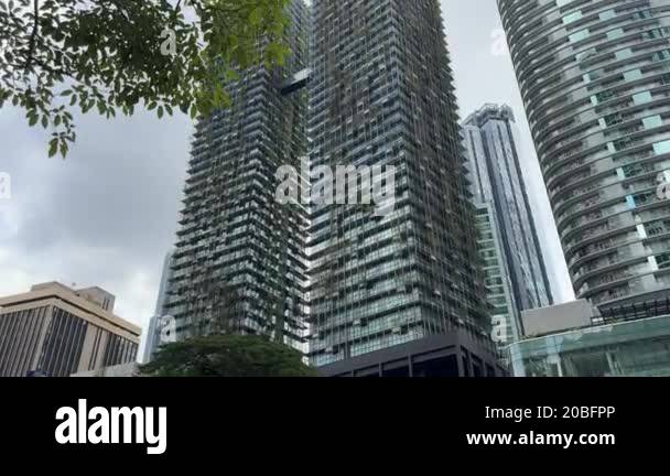 High-rise buildings with lush green terraces, standing in Kuala Lumpur ...