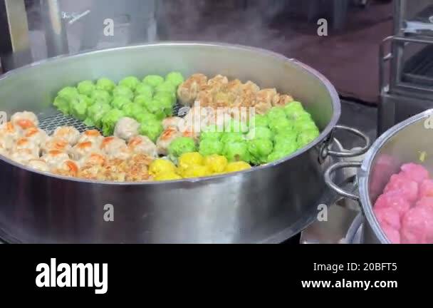 Popular Chinese food. Handmade Dim Sum with different fillings, steamed ...
