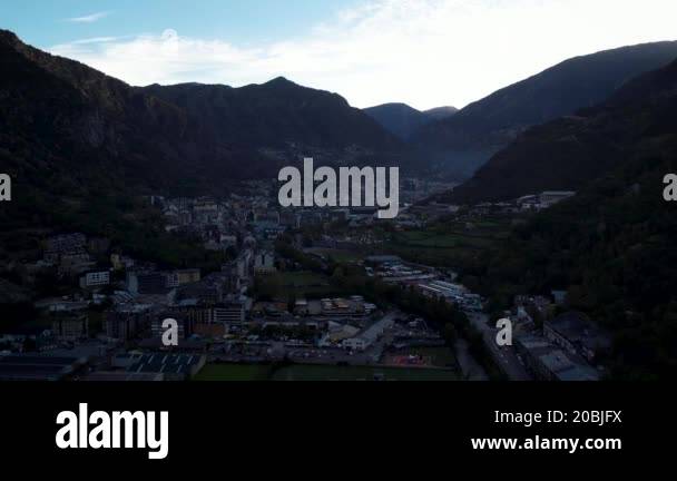 Andorra la Vella city at sunrise in the Pyrenees 4K drone footage. High ...