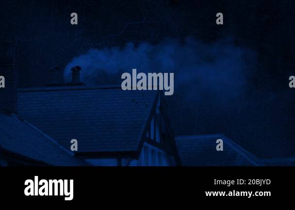 House With Smoking Chimney At Night Stock Video Footage - Alamy