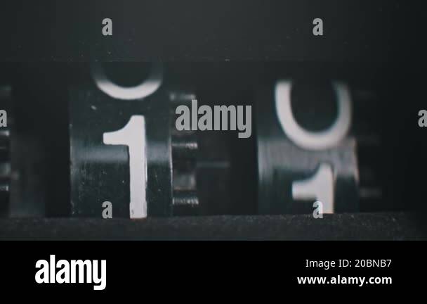 A close-up view of a retro-style number counter, its digits smoothly ...
