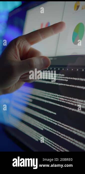 A closeup view of a hand engaging with a digital display, which ...