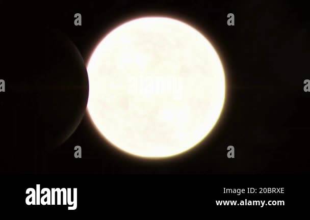 A dramatic close-up view of a solar eclipse, showcasing the moon obscuring a portion of the sun ...