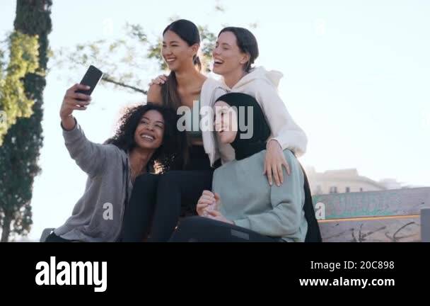 Video of a group of pretty friends with sporty clothes taking a selfie ...