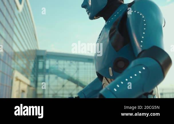 Happy child girl greets her robot friend hugging it future machine ...