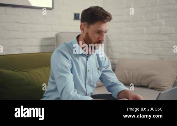 Unhappy businessman getting bad news on laptop at home internet remote ...