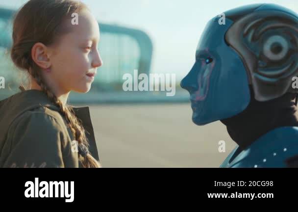 Happy child girl greets her robot friend touching each other foreheads future machine ...