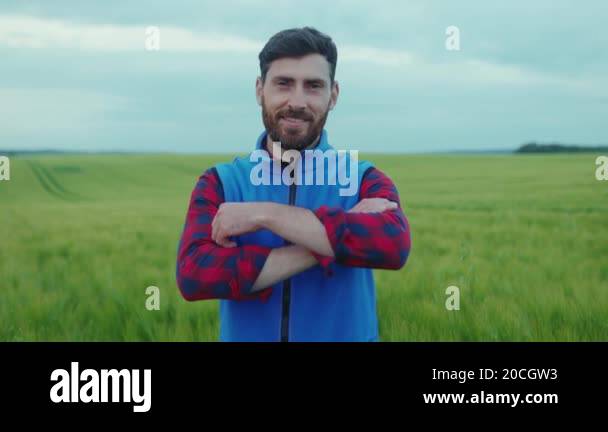 Close up portrait of farmer man with beard looking to camera smile ...
