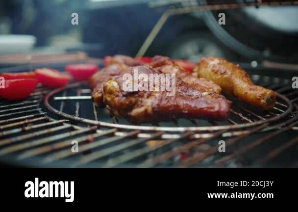 Grilling food. Appetizing video of roasted chicken marinated legs ...