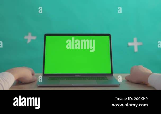 Close-up freelancer working by laptop in the office looking on ...