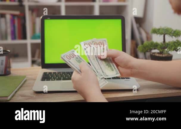 NEW YORK - April 5, 2019: Close up laptop computer with green screen ...
