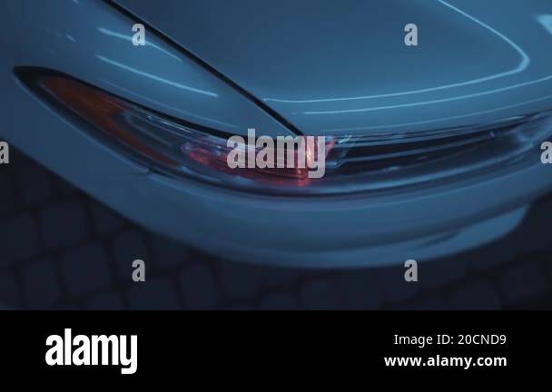 Top down view of white luxury new car standing with switched on shiny ...