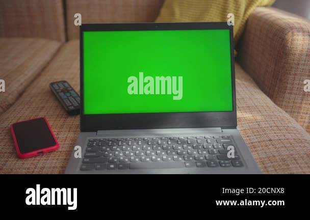 At sunset green screen on laptop at home workplace computer work ...