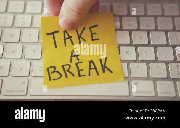 Man lays sticker on keyboard computer with handwritten inscription ...