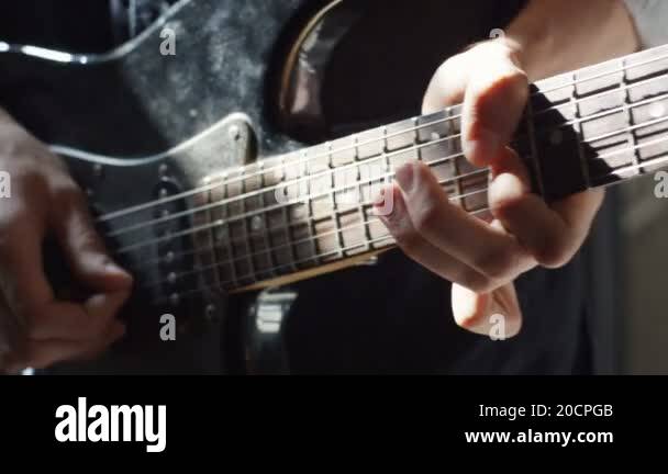 Close-up of a mans hands playing a guitar band blues concert performer ...