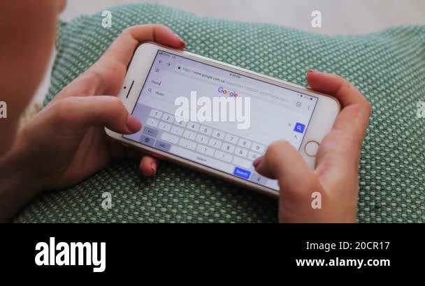 Tokio, Japan - April 7, 2018.Close up woman hands using smart phone ...