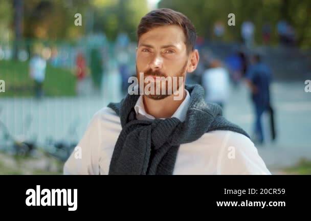 At sunlight portrait handsome disabled man in wheelchairat look at ...