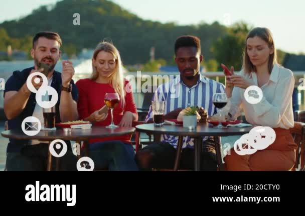 Group of Diverse Multi-race Friends Staying in Cafe Together Using ...