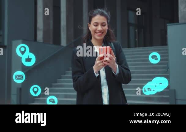 Attractive young woman walking use phone smile. Outdoor on street ...