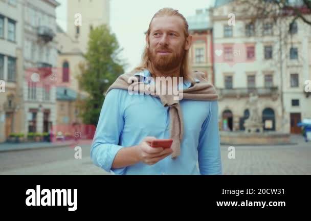 Smiling Bearded Man Use Phone Walking On City Street Successful