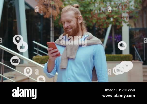 Attractive bearded man use phone stand on city street . Successful ...