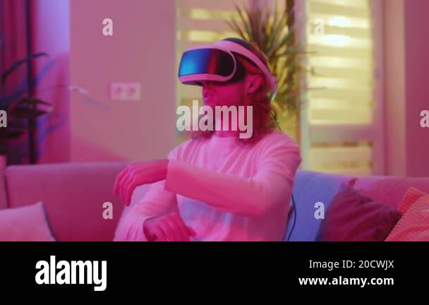 Active young adult gamer playing virtual 3D simulator diver game ...