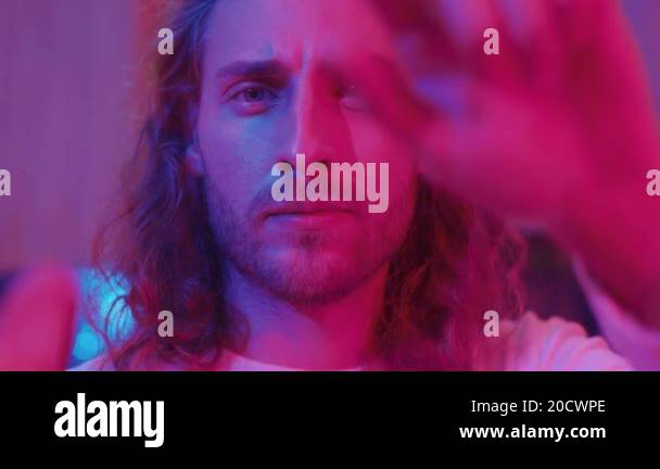 Neon portrait of handsome caucasian man using smart application ...