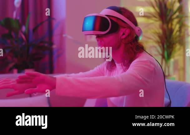 Active adventurous man caucasian young gamer playing virtual reality ...