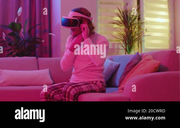 Caucasian hipster gamer young man wearing augmented reality VR helmet ...
