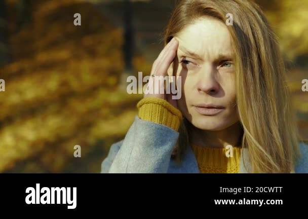 Close up face sick young woman having headache feel cold sneezes stand ...
