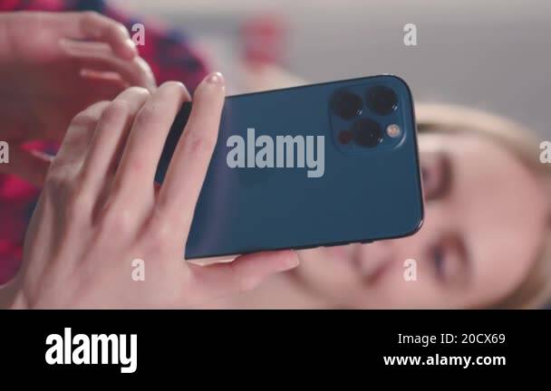 Close up vertical shot of hand young woman using mobile phone ...